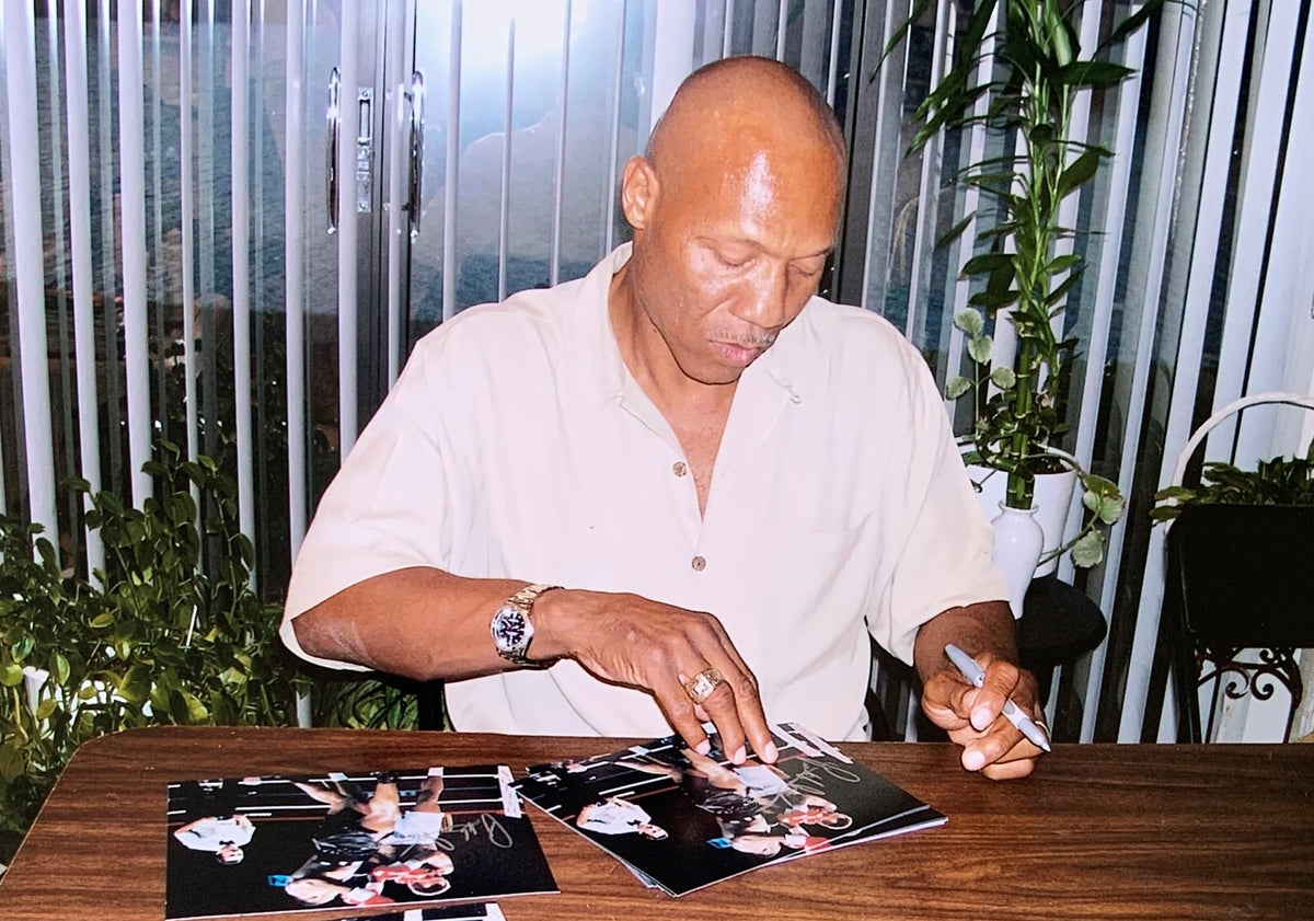 THOMAS, PINKLON SIGNED PHOTO (STINSON LOA) – JO Sports Inc.